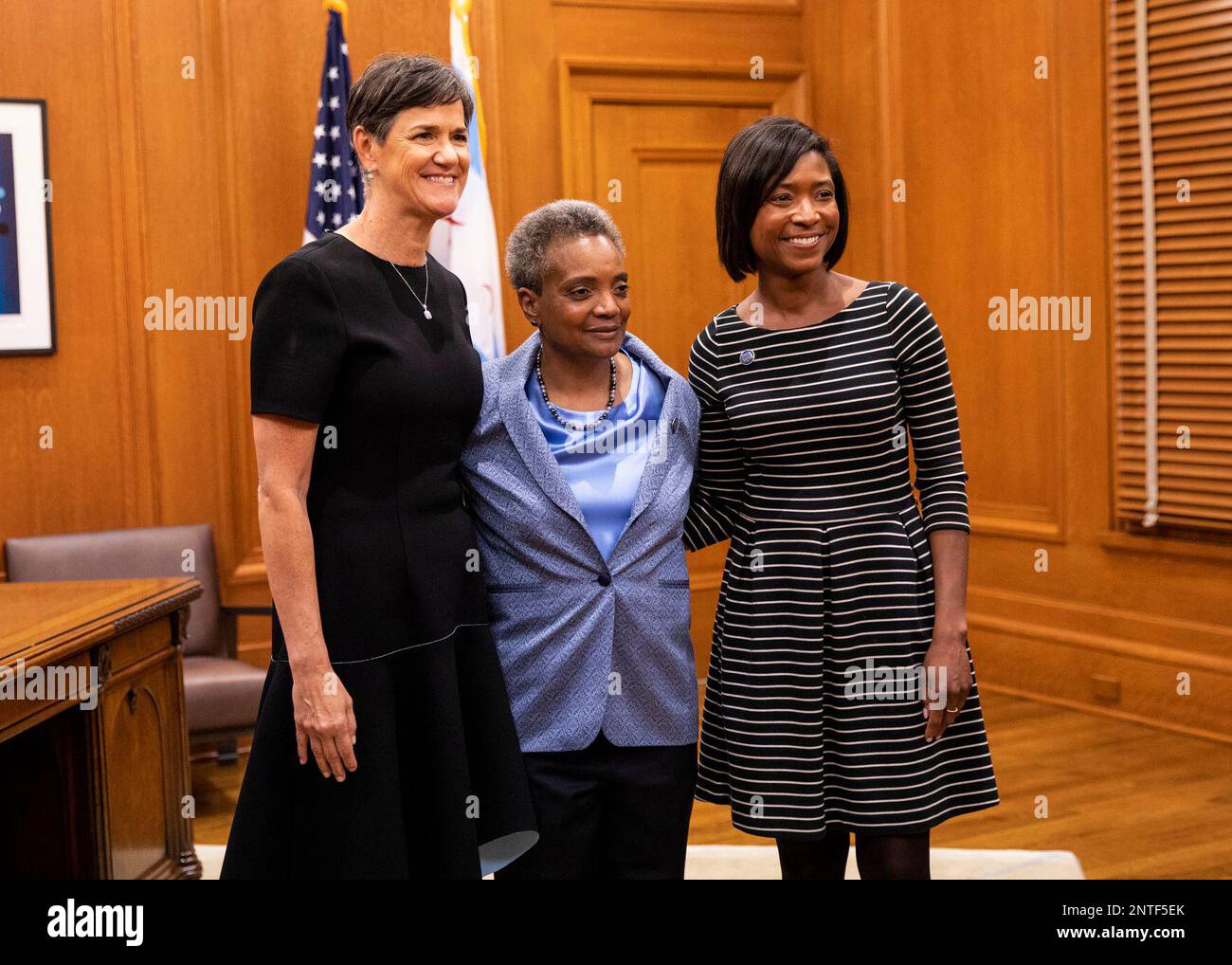 Mayor Lori Lightfoot and her wife, Amy Eshleman, greet and take photos ...
