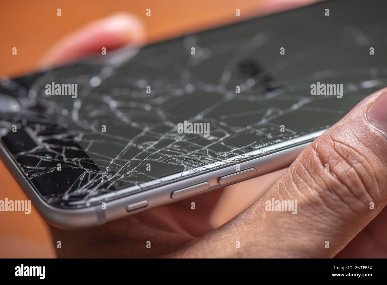closeup cracked screen on broken smart phone Stock Photo - Alamy