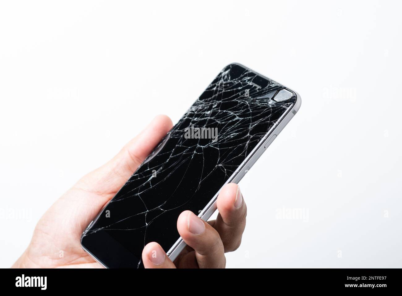 closeup cracked screen on broken smart phone Stock Photo - Alamy