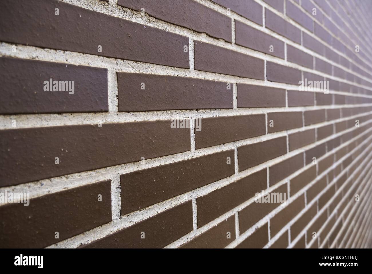 Detail of smooth red brick facade, construction and exterior ...
