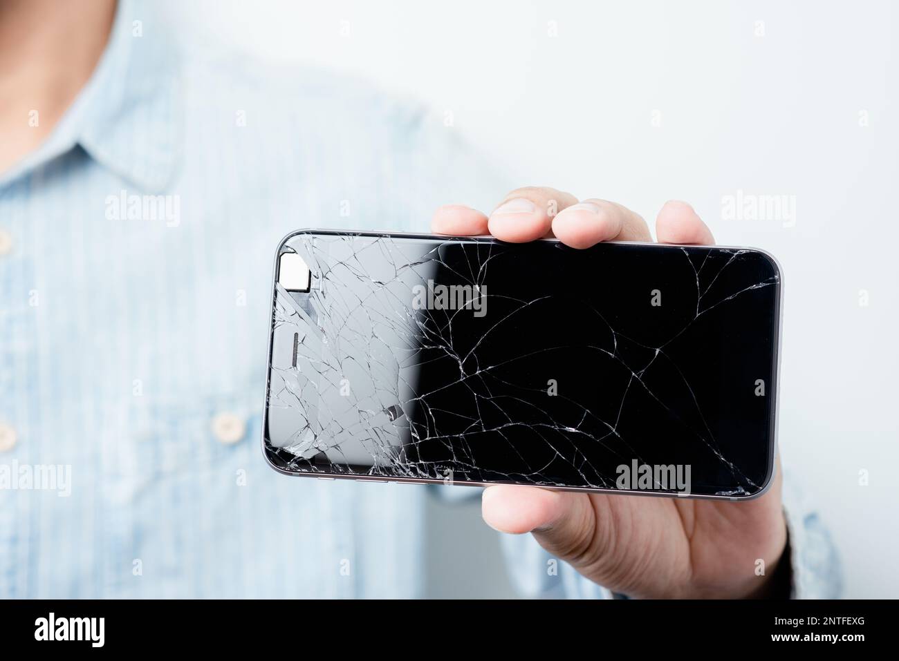 closeup cracked screen on broken smart phone Stock Photo - Alamy