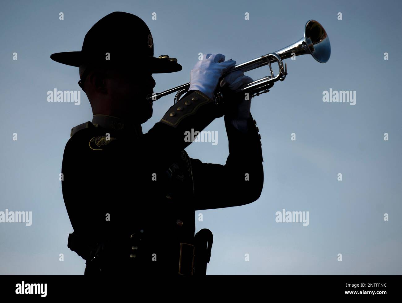 Tennessee Highway Patrol Trooper James Kipper plays Taps at the end of ...