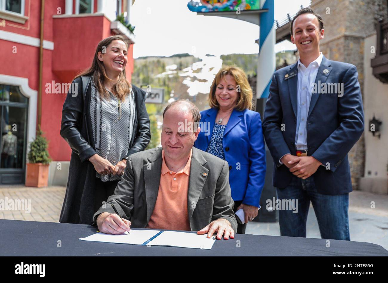 Colorado Gov. Jared Polis signs multiple bills as, from left, state Sen ...