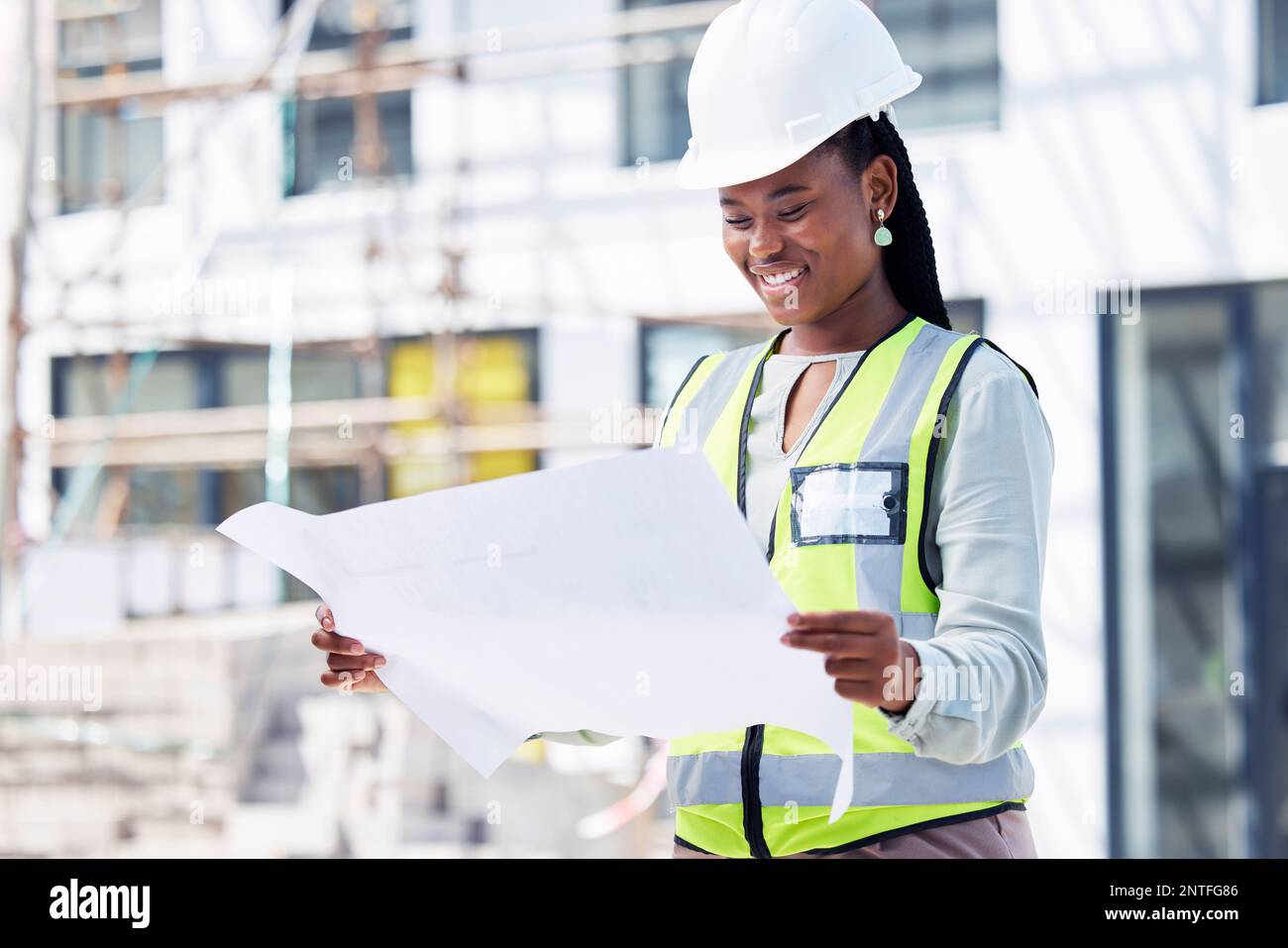 Architect, black woman and blueprint for building at a construction ...