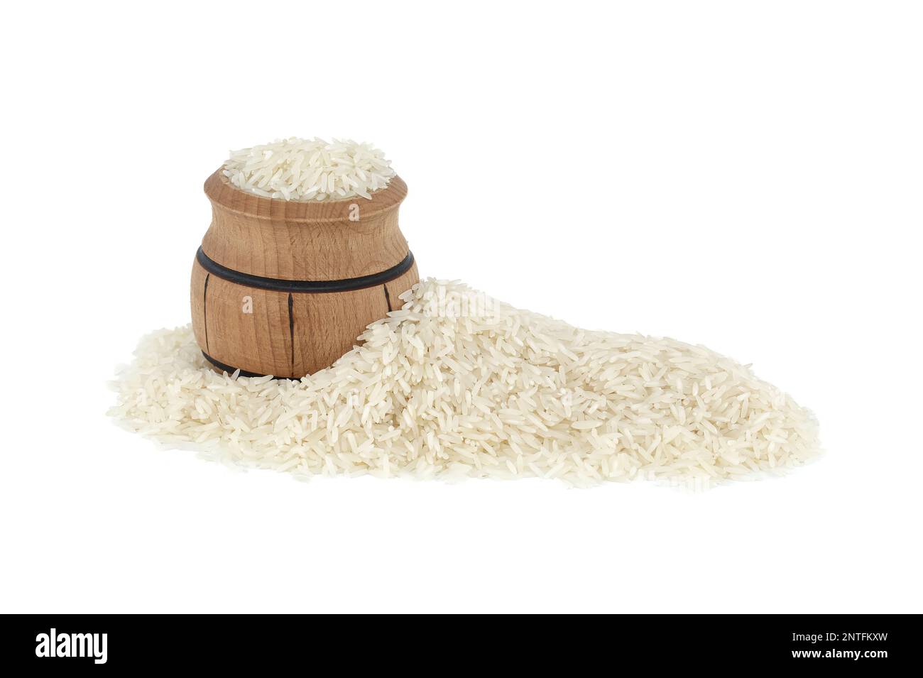 Dry long-grain rice in small wooden barrel isolated on white background ...