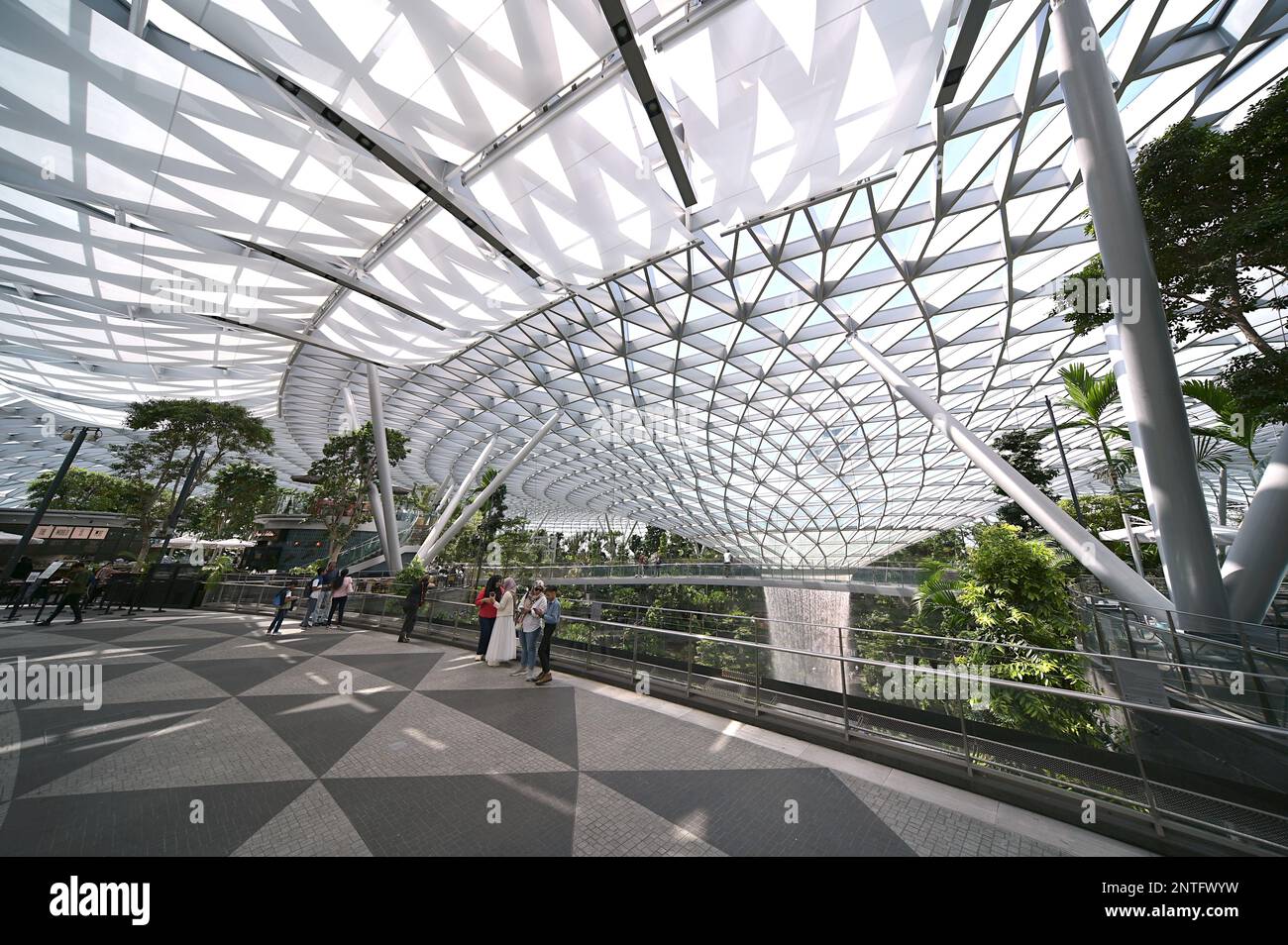 Visitors posing for pictures at the Canopy Park at Jewel Changi Airport ...