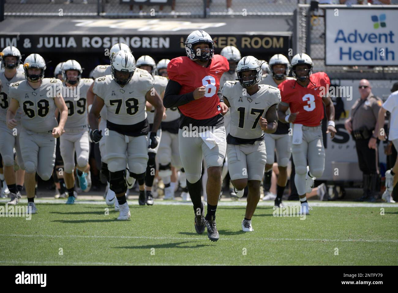 Central Florida quarterback Darriel Mack Jr. (8) leads the team onto ...