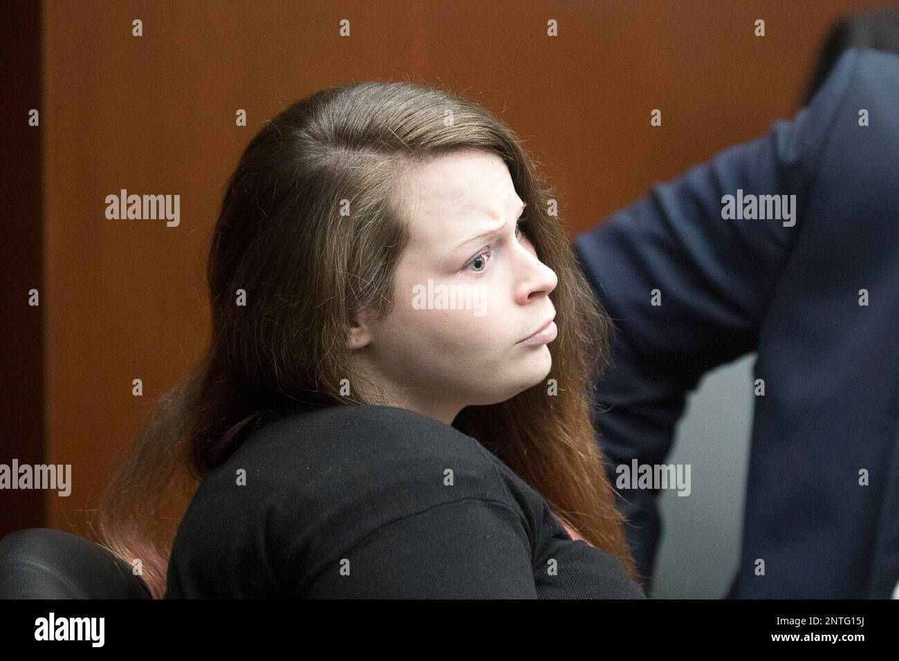 Cortney Bell sits with her lawyers during her and Christopher McNabb's ...