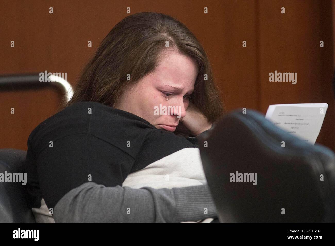 Cortney Bell becomes emotional while listening to a recording of a ...
