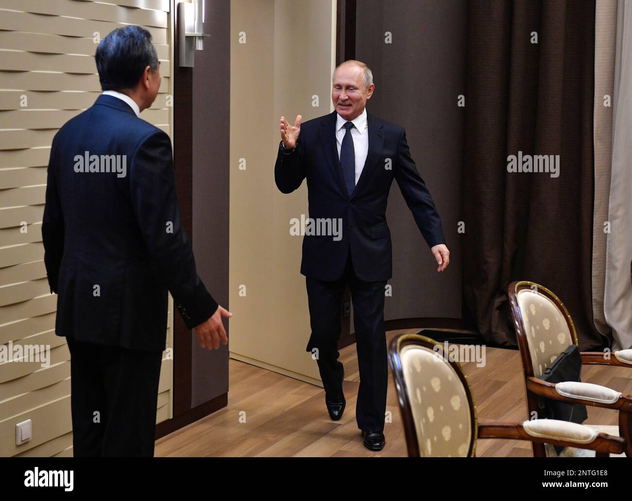 Russian President Vladimir Putin, right, greets Chinese Foreign ...