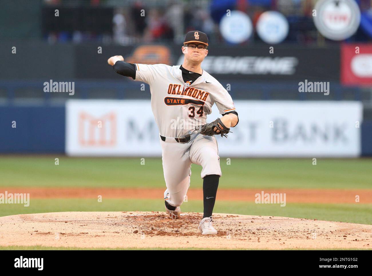 Oklahoma State Cowboys Jensen Elliott (34) delivers a pitch and throws ...