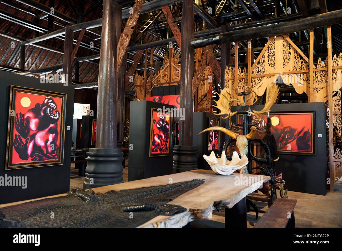 the interior of a hall within the Black Temple in Thailand, which ...