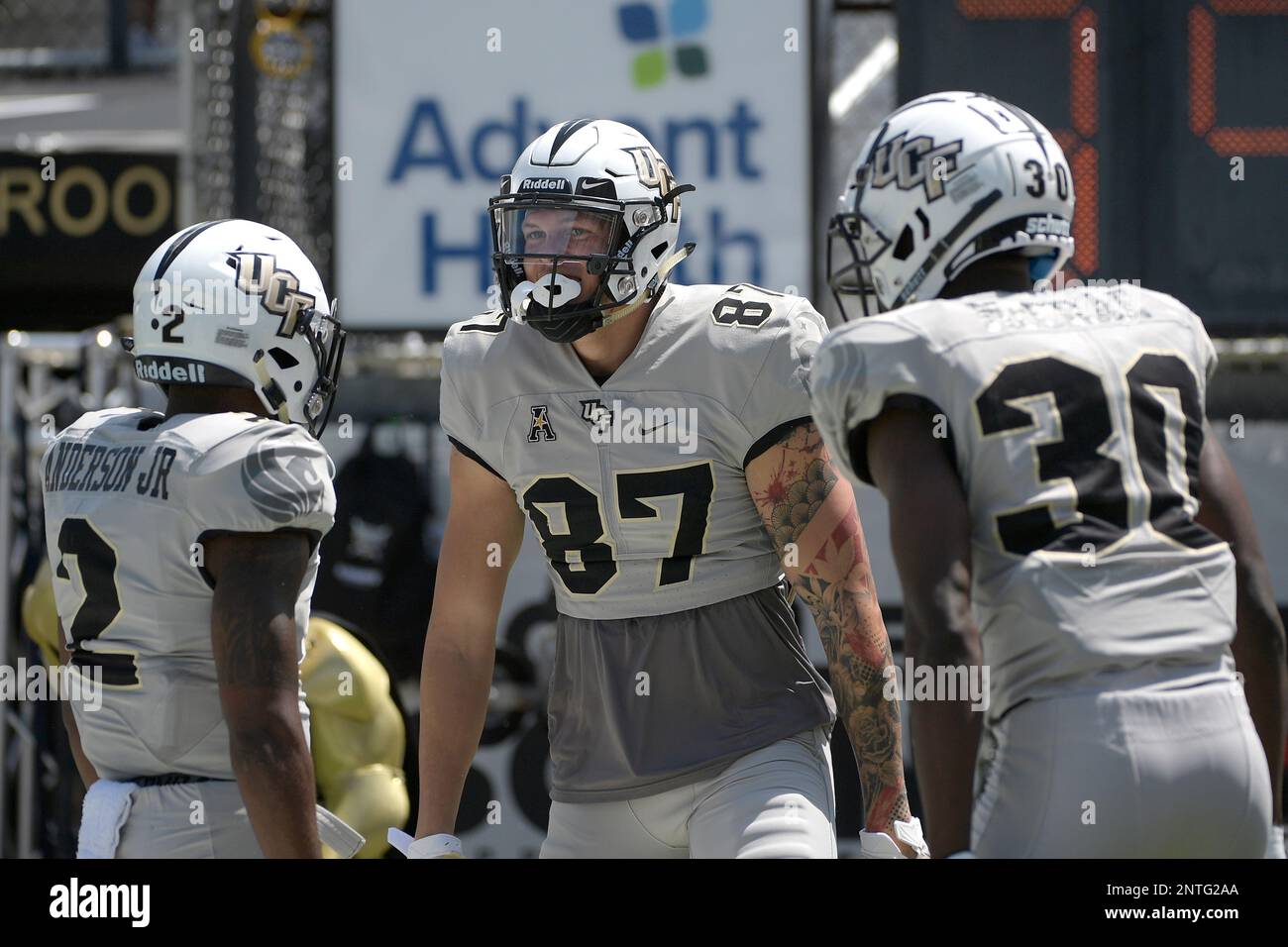 Central Florida receiver Jacob Harris (87) is congratulated by running ...