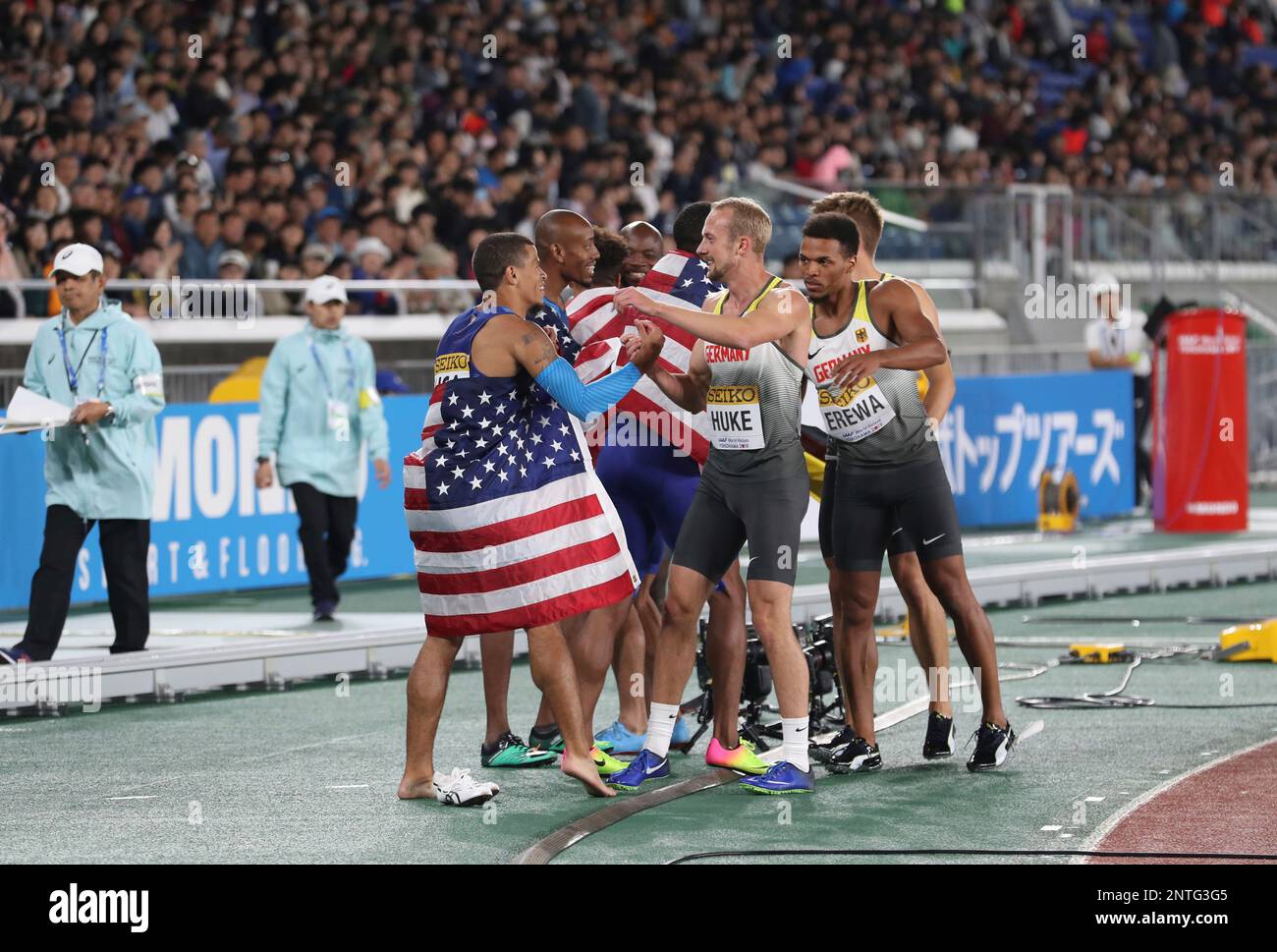 U.S. and German runners celebrate after the 4x200 Metres Relay Men ...