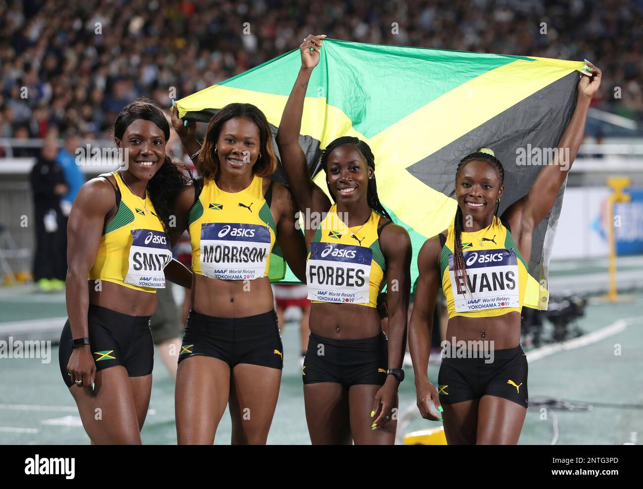 (L to r) Jamaica's Gayon EVANS celebrate after claiming silver medal of ...