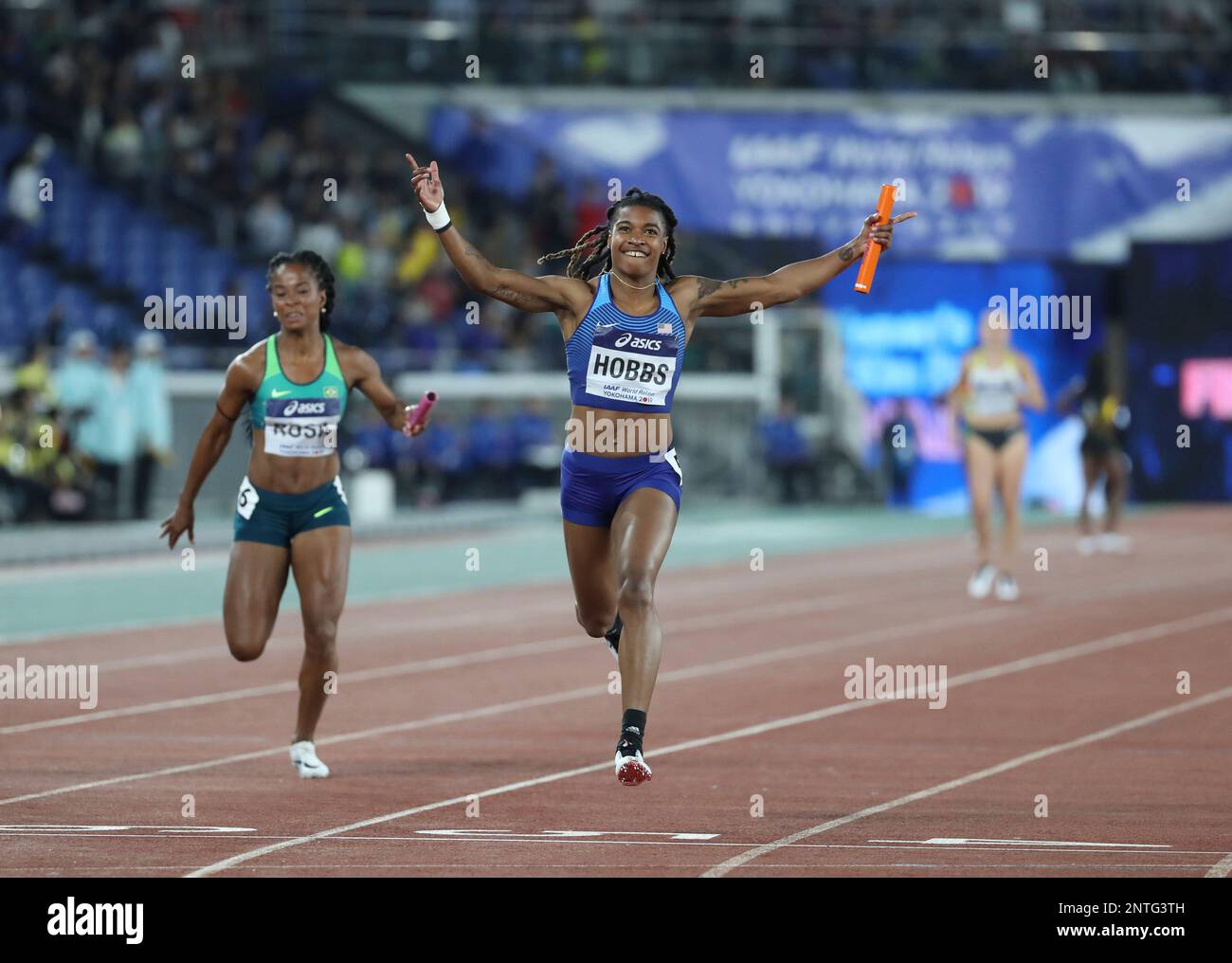 U.S. Aleia HOBBS (blue shirt) reacts as winning the 4x100 Metres Relay ...