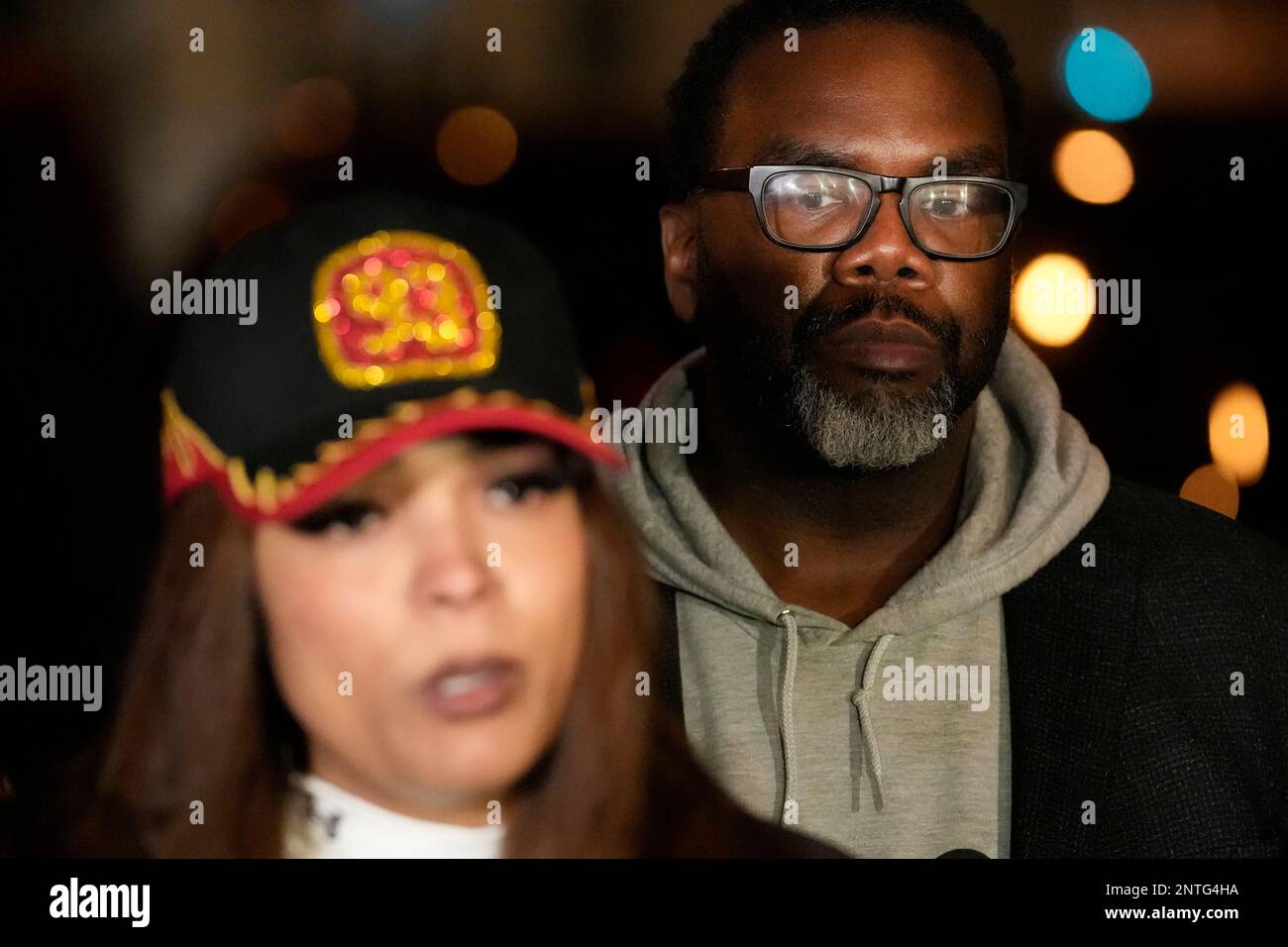 Chicago mayoral candidate Brandon Johnson, right, listens to homeless ...