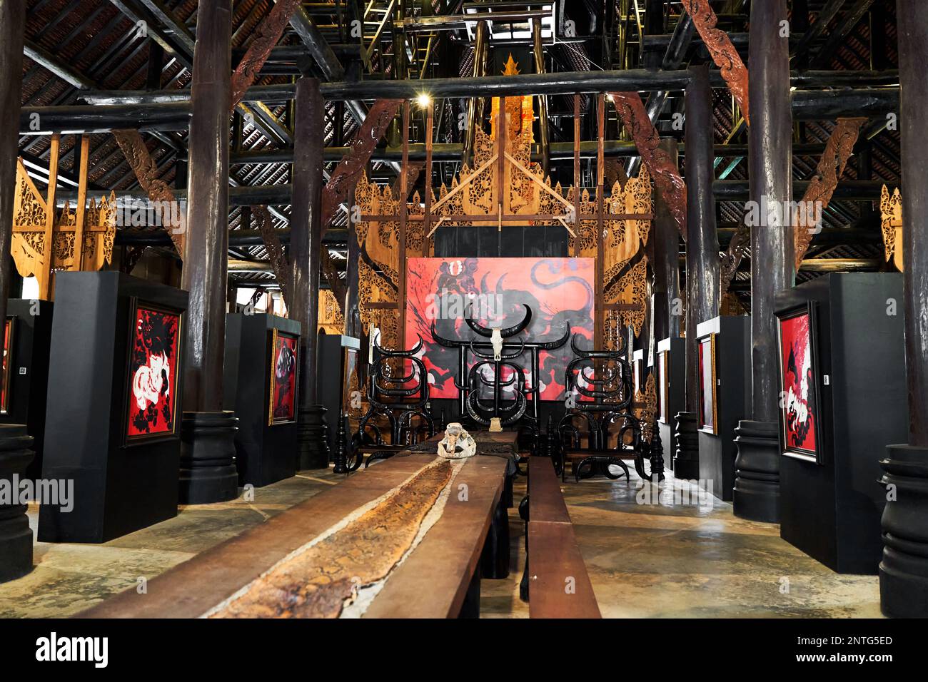the interior of a hall within the Black Temple in Thailand, which ...