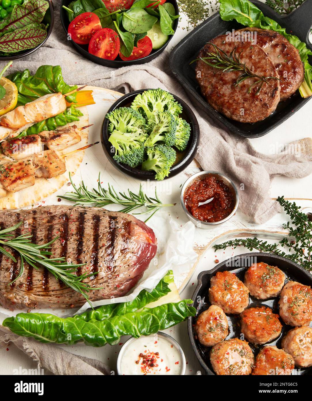 Various types of healthy cooked meat - beef, pork, chicken on a light ...