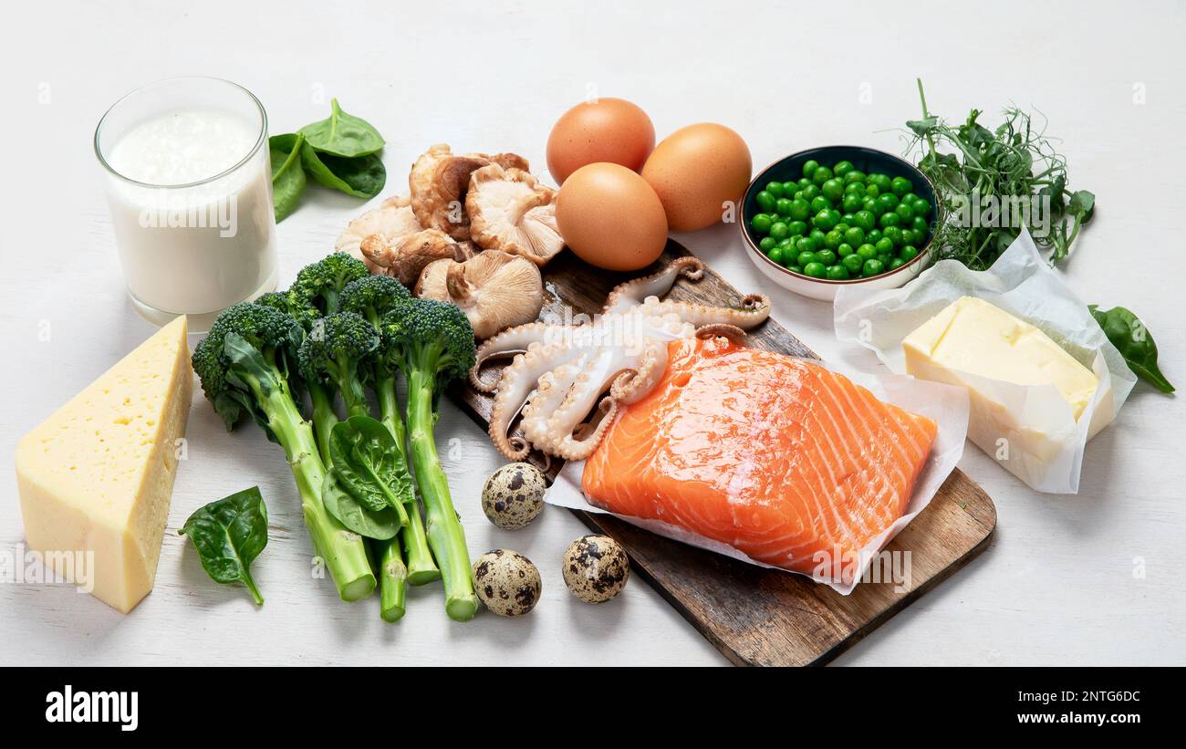 Composition with products rich in vitamin D on white background, top ...