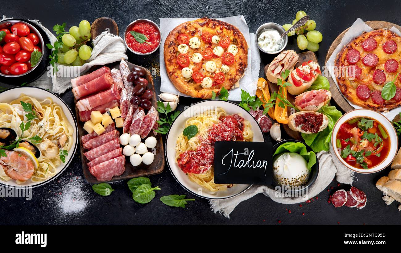Italian food dishes on dark background. Traditional italian cuisine ...