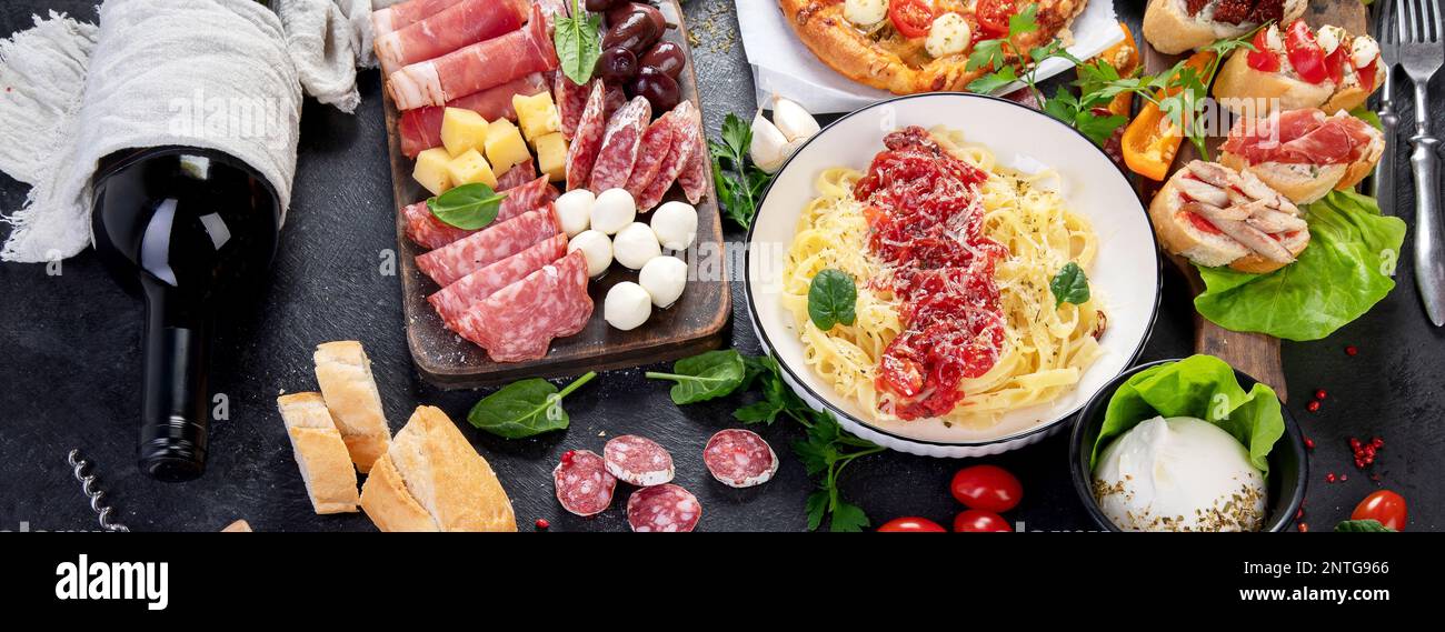 Italian food dishes on dark background. Traditional italian cuisine ...