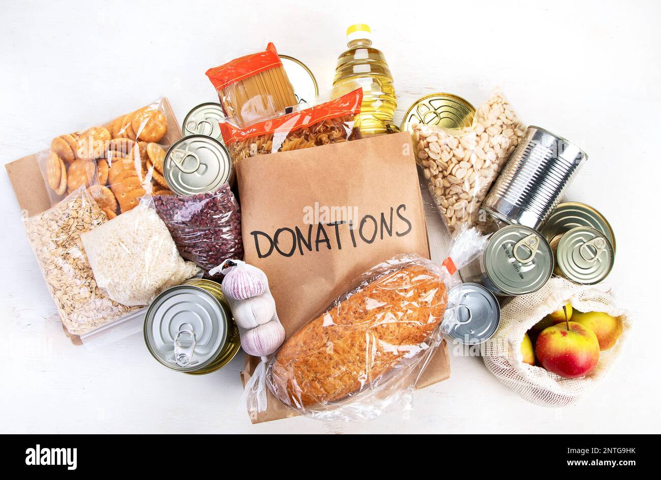 Food donations with pasta, rice, oil, peanut butter, canned food, jam ...