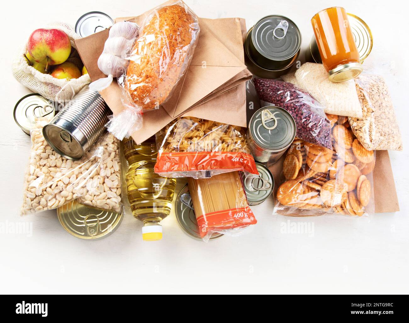 Food donations with pasta, rice, oil, peanut butter, canned food, jam ...