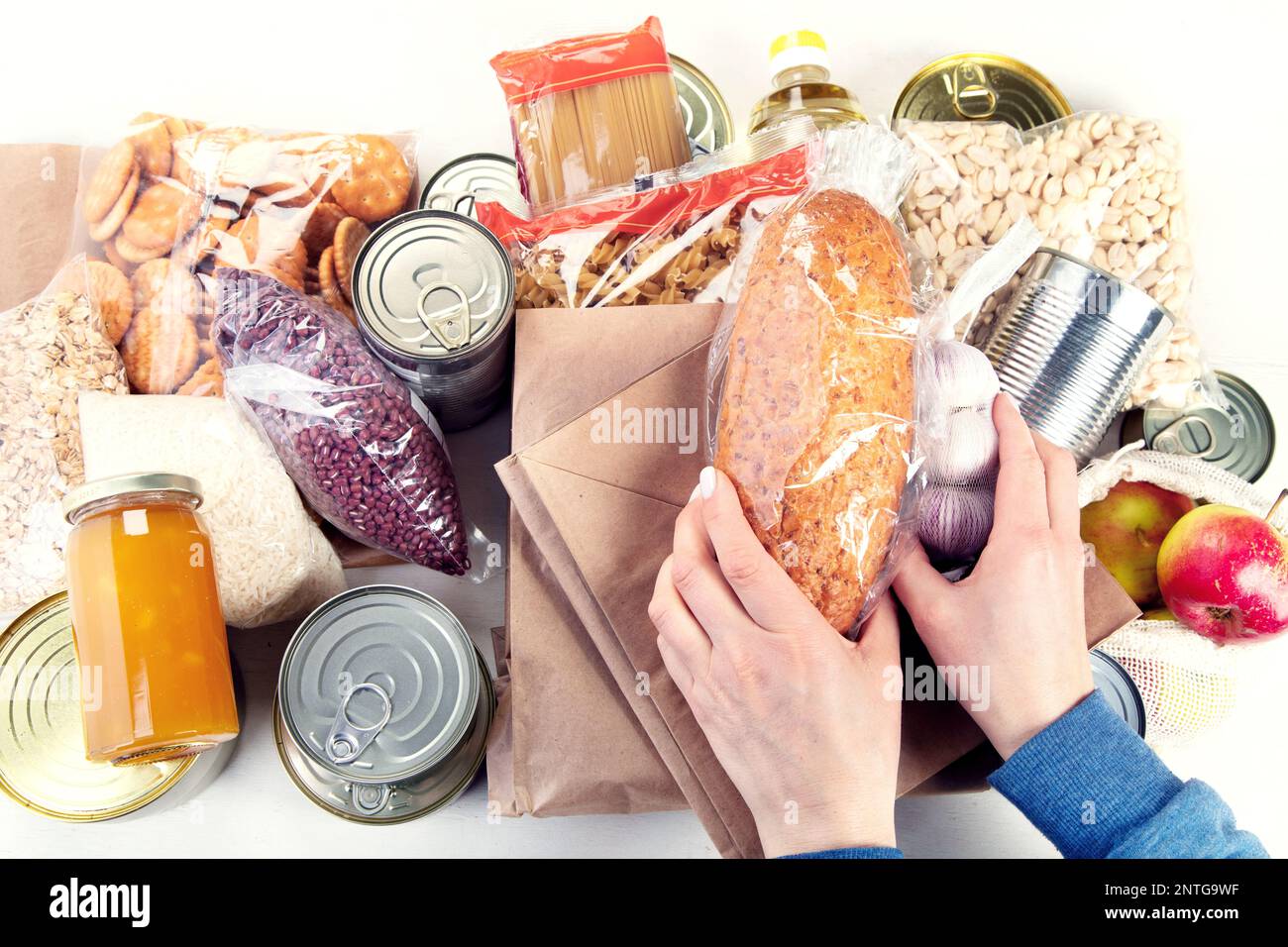 Food donations with pasta, rice, oil, peanut butter, canned food, jam ...