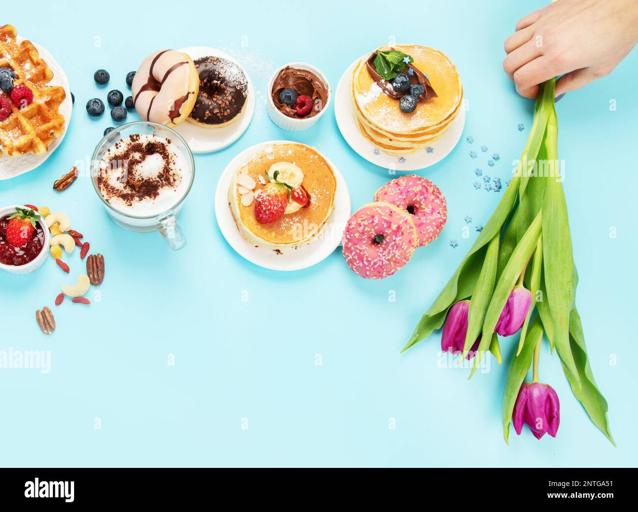 Summer or spring breakfast with Cup of hot cappuccino coffee, pancakes ...