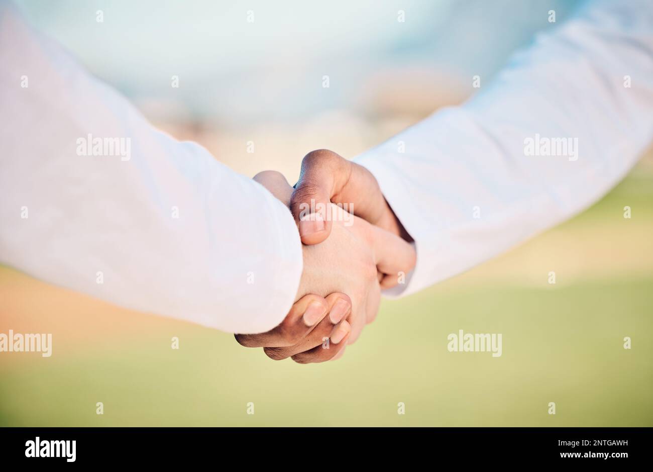 Handshake, fitness and outdoor showing team support, community and ...