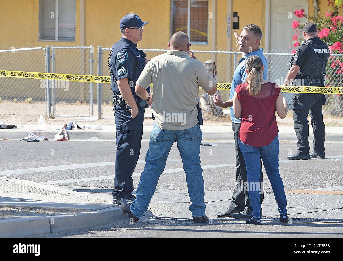 Police Department investigators work the scene of a shooting Friday ...