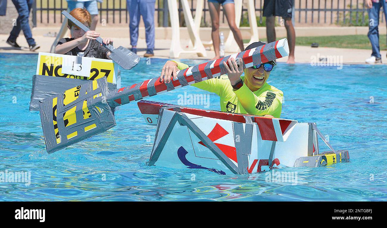 David Zak, with McCarthy Building Companies, paddles the sponsor boat ...