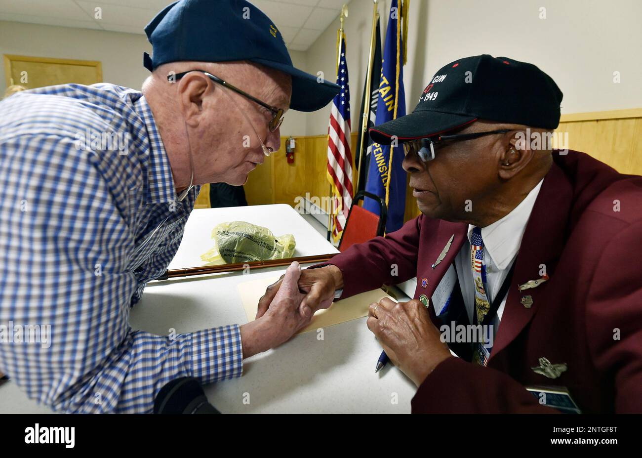 Lt. Col. James H. Harvey, Tuskegee Airmen, talks with a neighbor and ...
