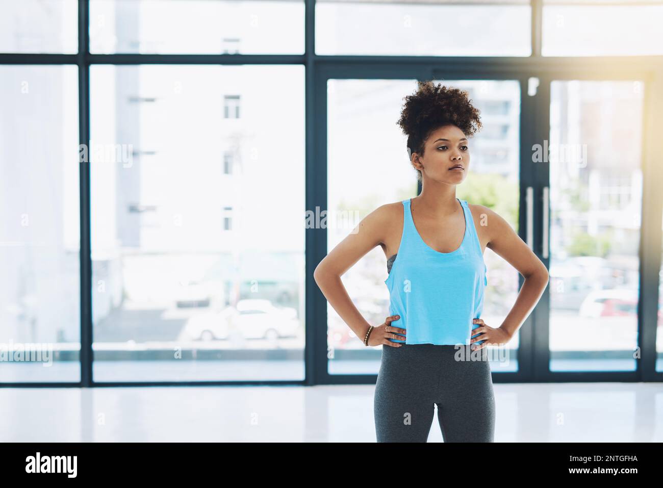 Another workout session. a young fit woman standing and getting ready ...