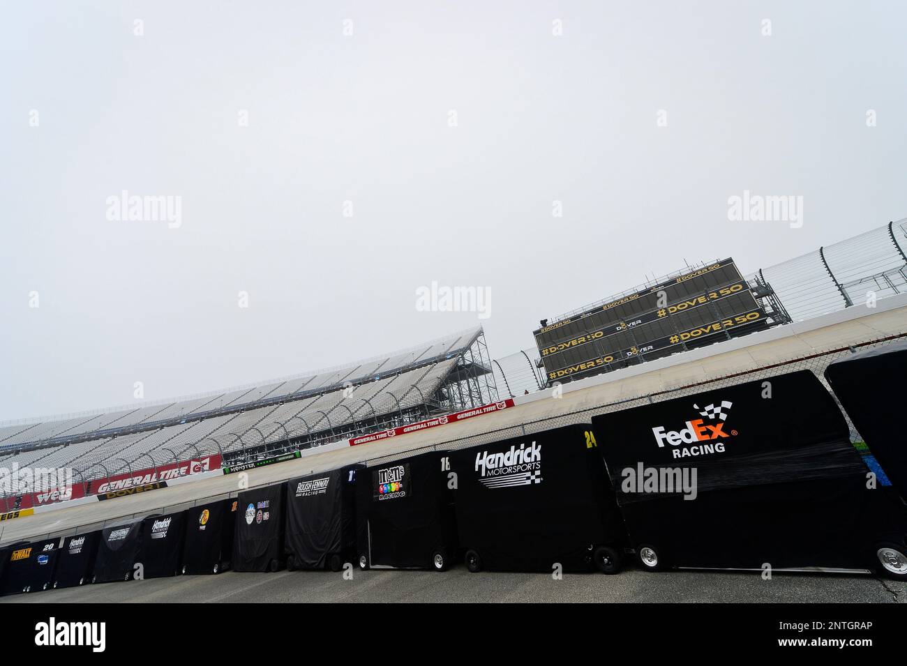Pit boxes line the perimeter of the garage area during practice for the ...