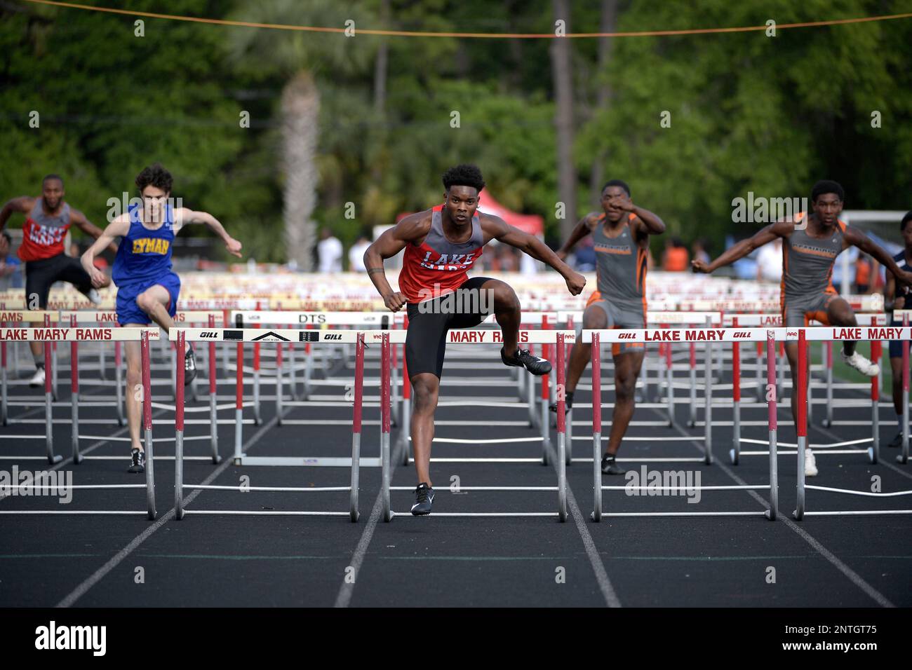 Lake Mary's Seraiah Abram, center, wins the Men's 110-meter hurdles ...