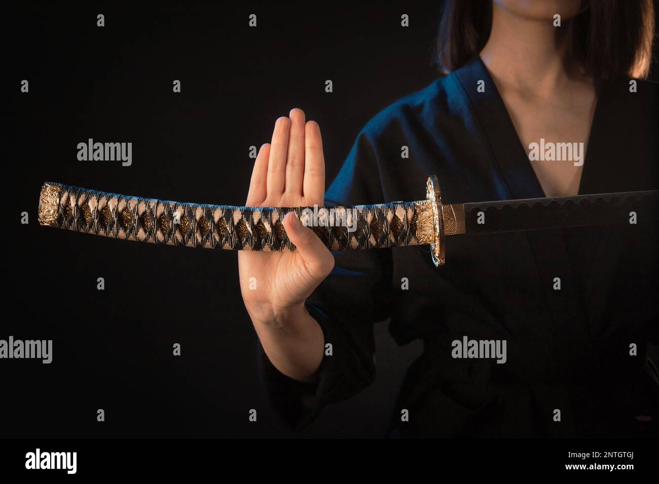 Hand on sword hilt hi-res stock photography and images - Alamy