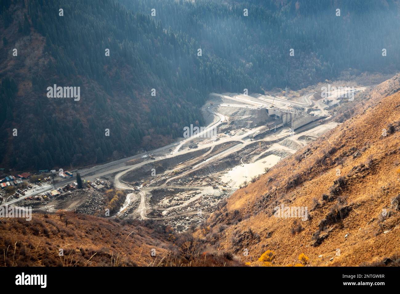 View from the mountain on construction of a mudflow protection dam in ...