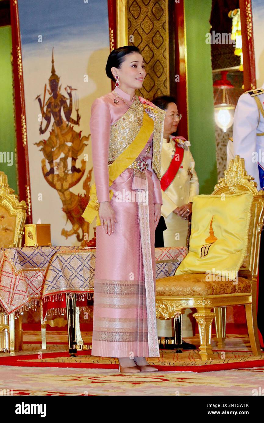 In this photo released by Bureau of the Royal Household, Queen Suthida ...