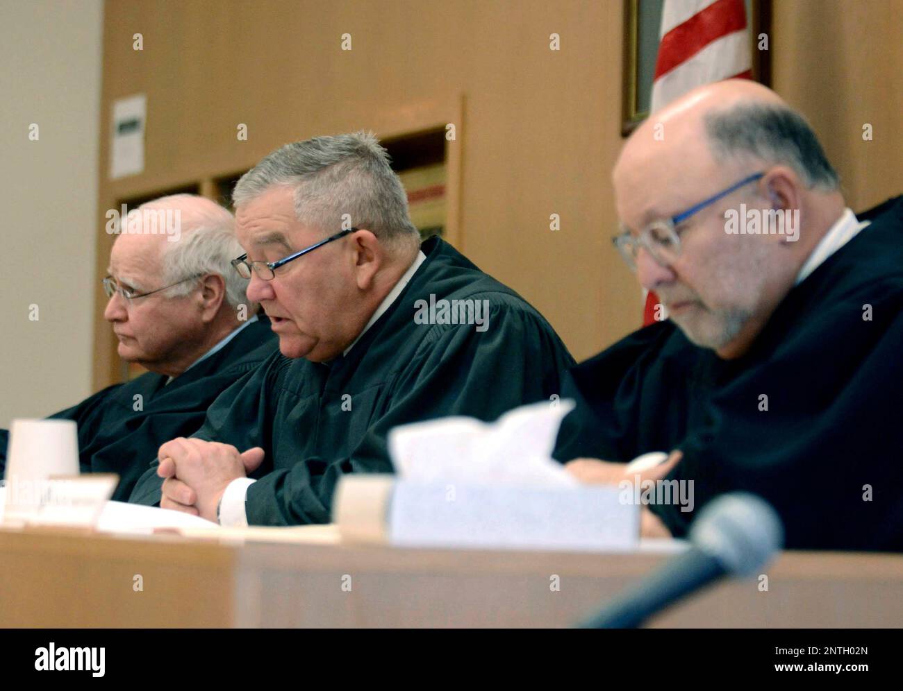 In this Feb. 22, 2019 photo, Judge Jack Fisher, center, reads a verdict ...