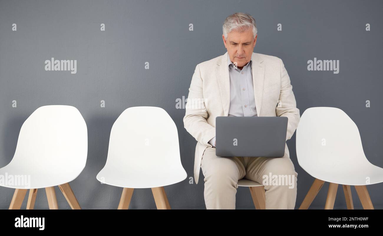 Mature business man, laptop and waiting room, queue and interview line ...