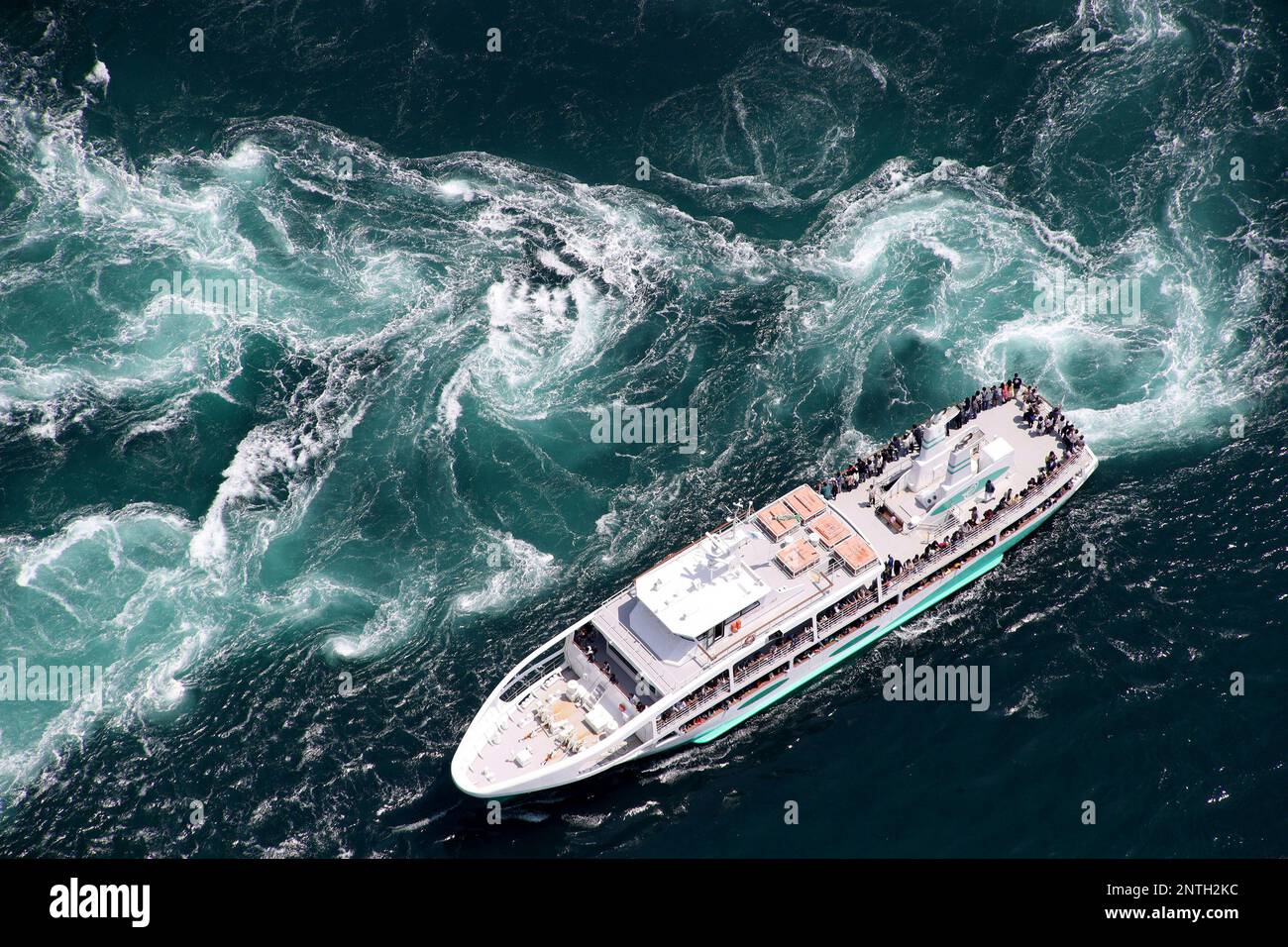 An aerial photo taken from a helicopter shows a tourist ship crusing ...