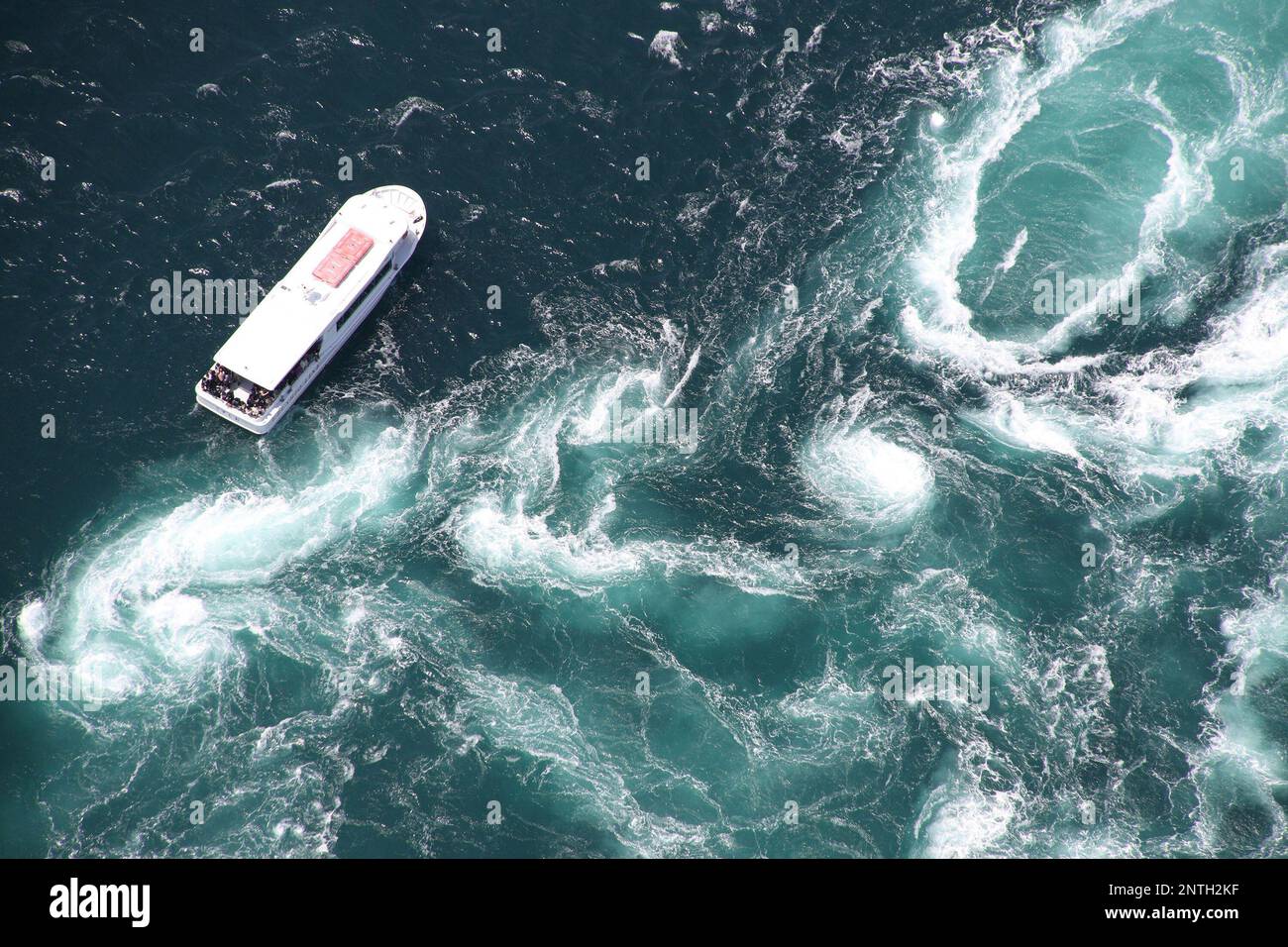 An aerial photo taken from a helicopter shows a tourist ship crusing ...