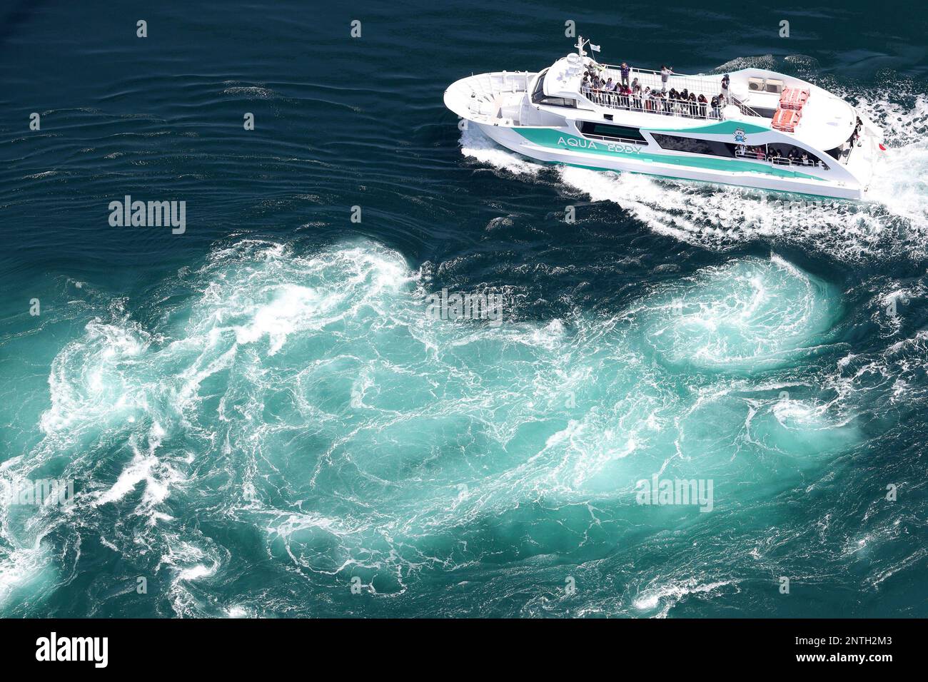An aerial photo taken from a helicopter shows a tourist ship crusing ...