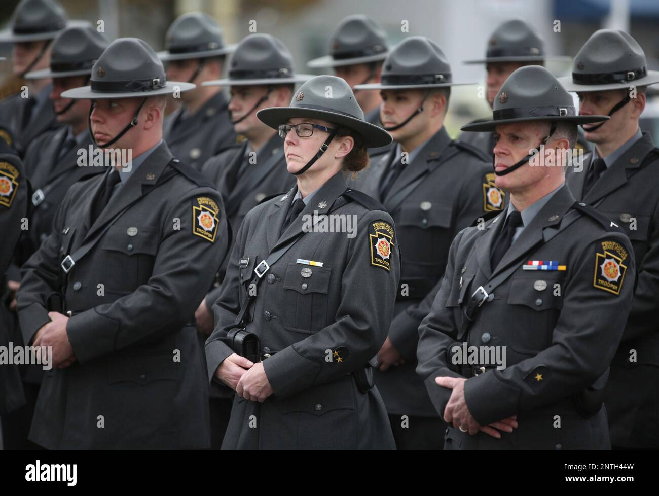 Pennsylvania State Police Troopers stand in formation during the ...