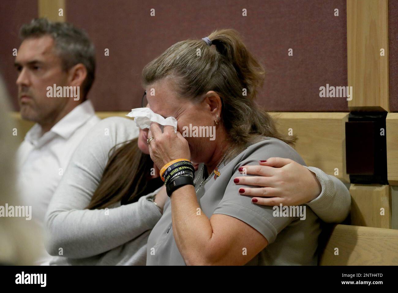 Debbi Hixon, the widow of victim Chris Hixon is consoled in court by ...