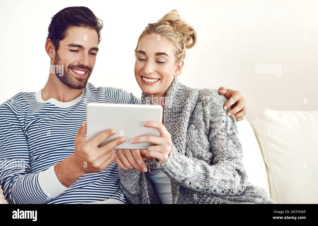 I love how all his statuses are about me. a young couple using a ...