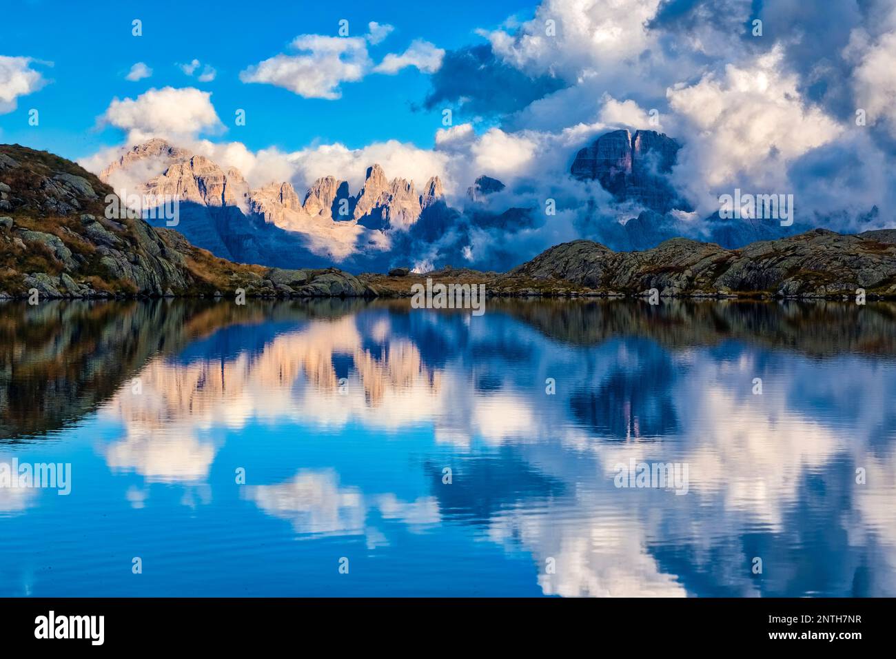 The main range of Brenta Dolomites, partially shrouded in storm clouds ...