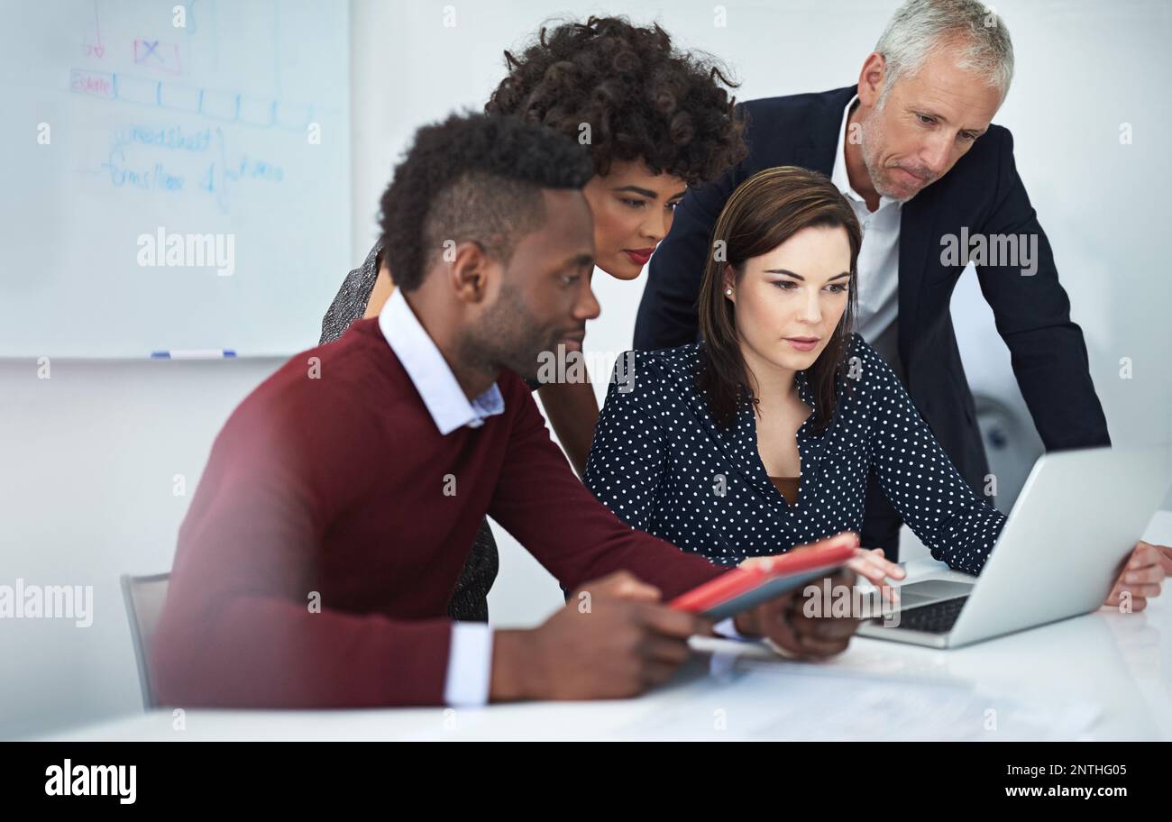 Getting their input on her latest project. a group of businesspeople ...